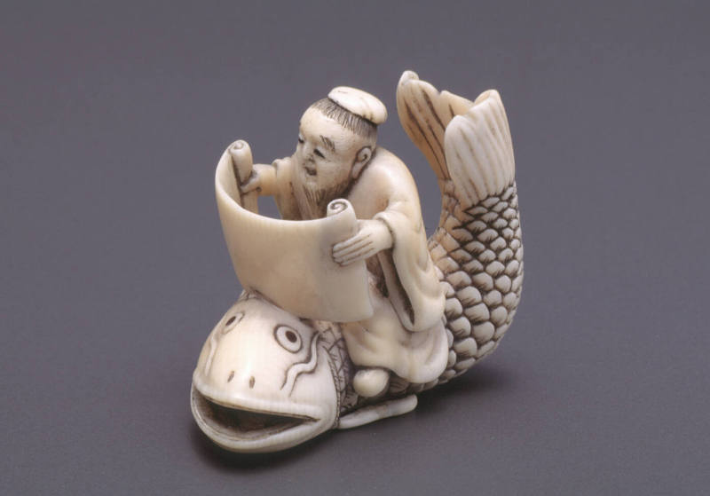 Netsuke modelled as Kinko Shonin seated on a fish – Works – eMuseum